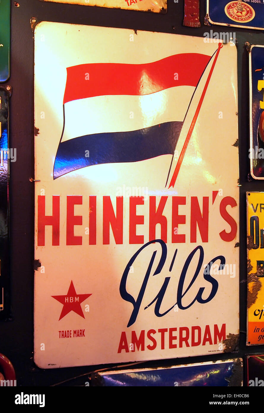This enamel advertising sign for Heineken Pils showcases the branding ...