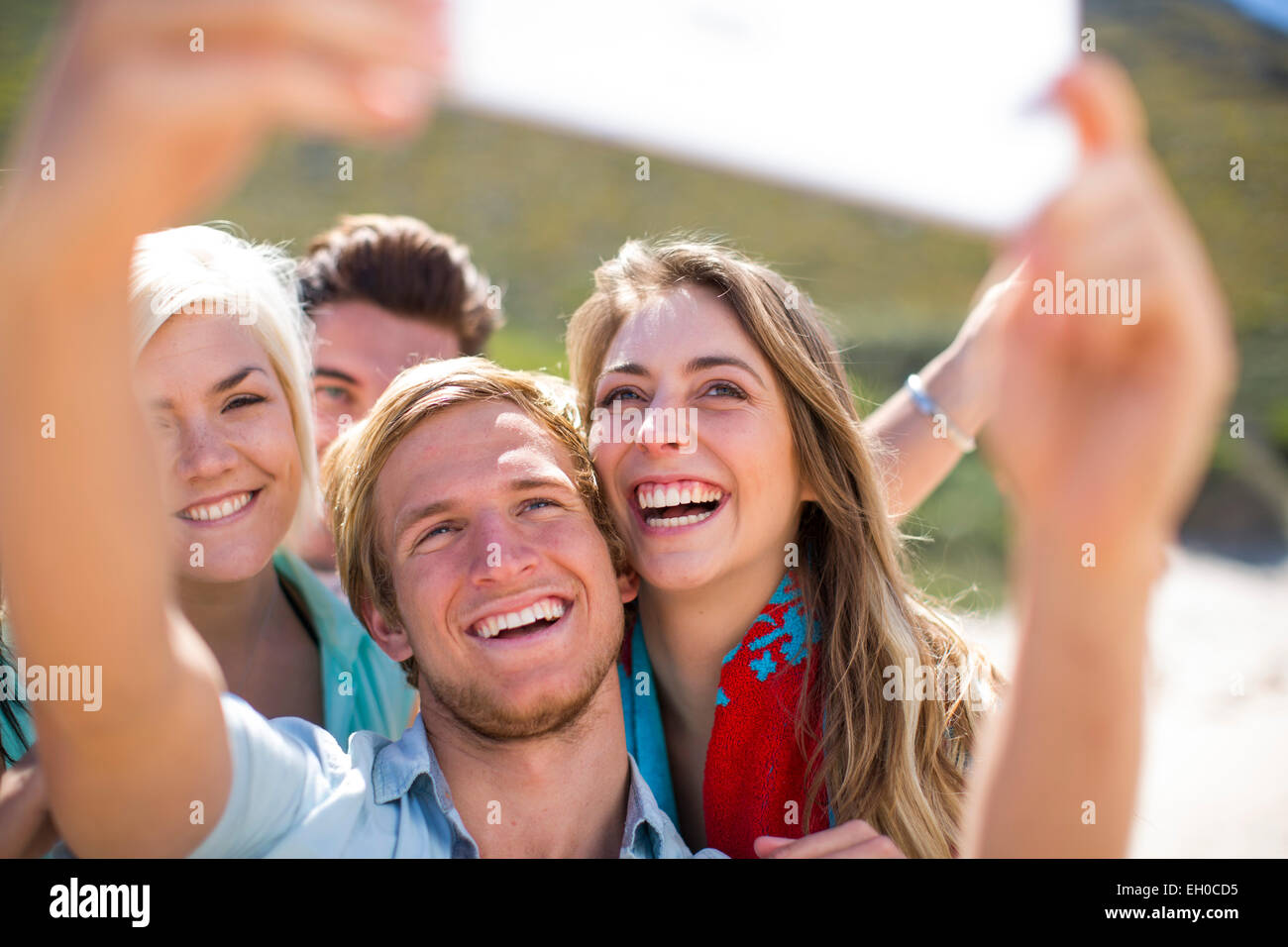 Friends taking selfies with a tablet Stock Photo - Alamy