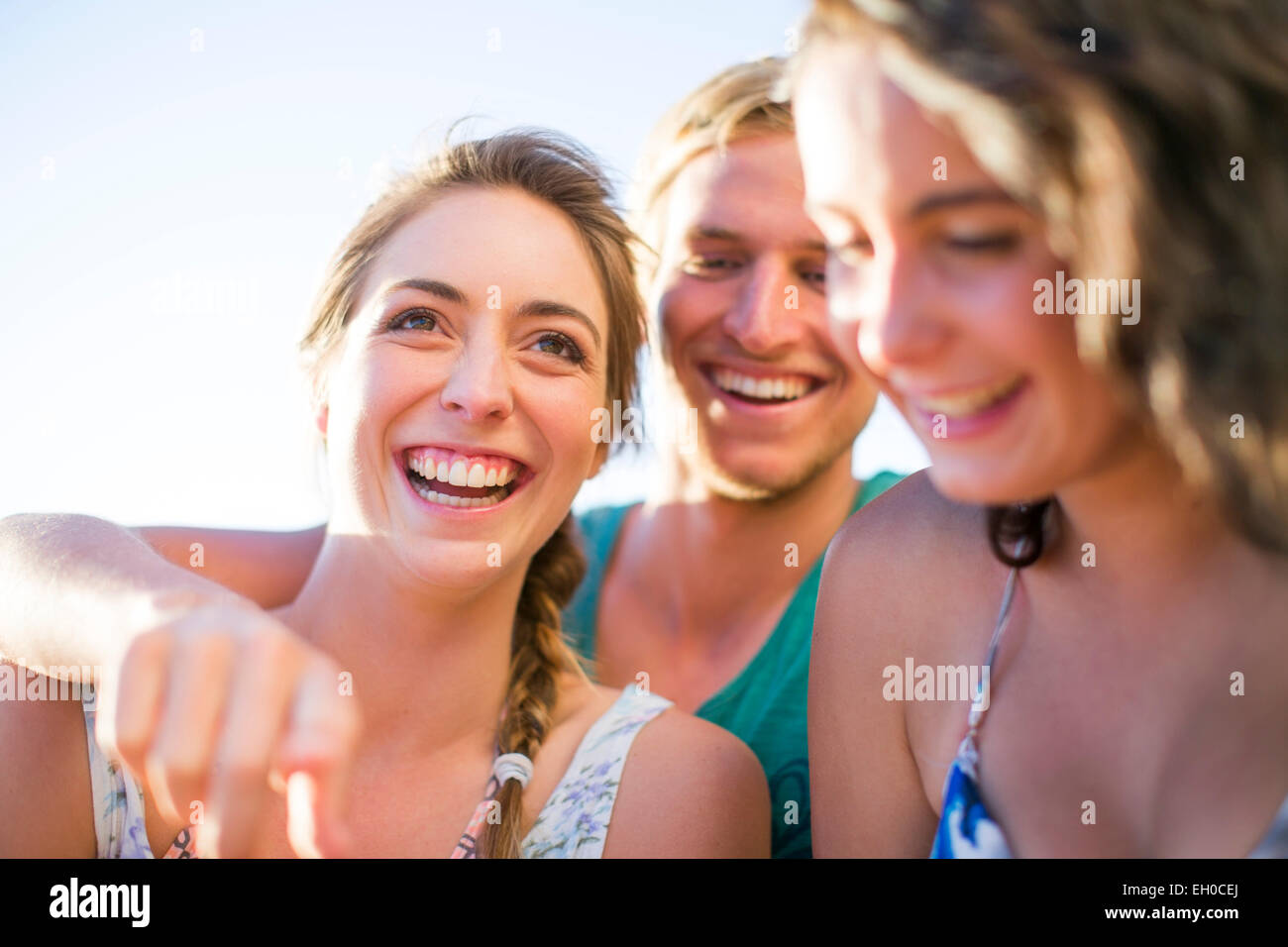 Three happy friends outdoors Stock Photo - Alamy