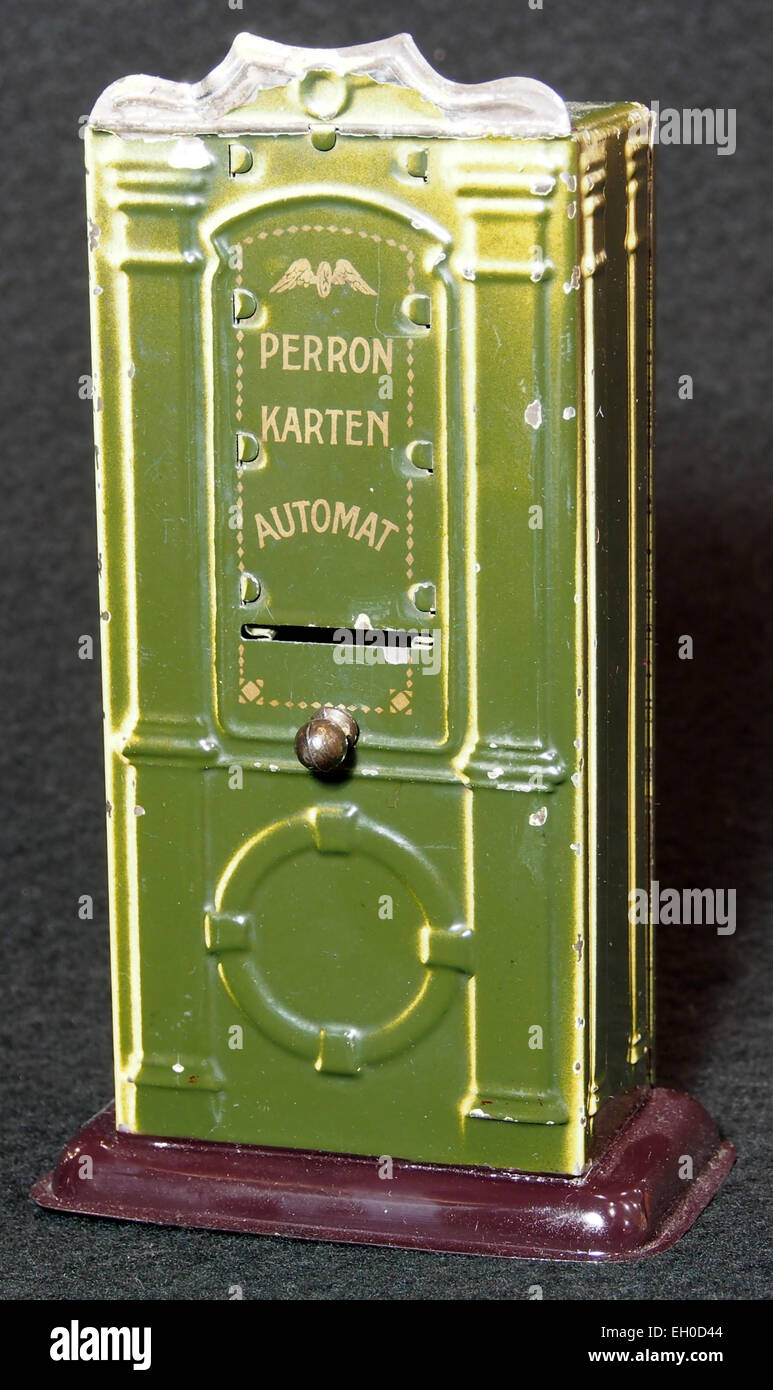 The Peron Karten Automat is a vintage tin toy, a type of mechanical ...