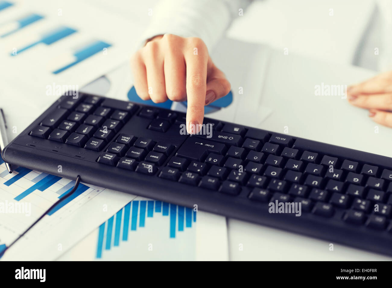 woman hand pressing enter button on keyboard Stock Photo - Alamy