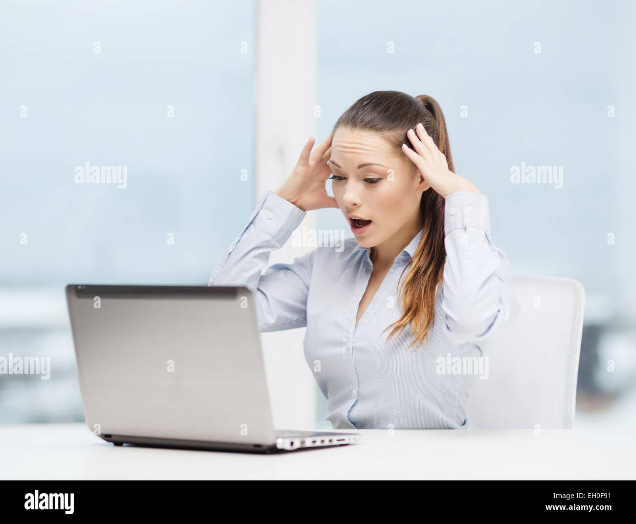 stressed woman with laptop Stock Photo - Alamy