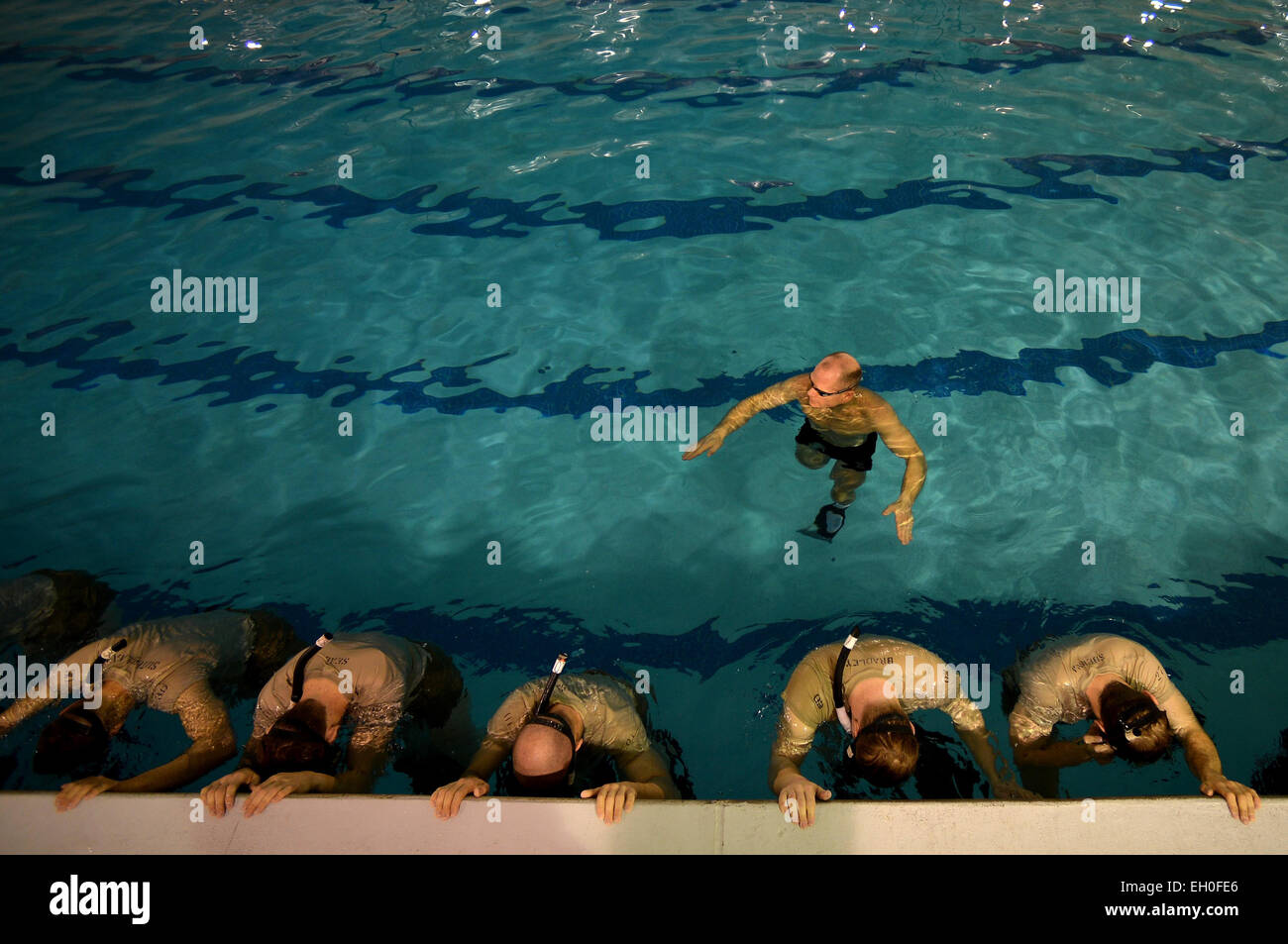 A combat control instructor gives commands to trainees during an early ...