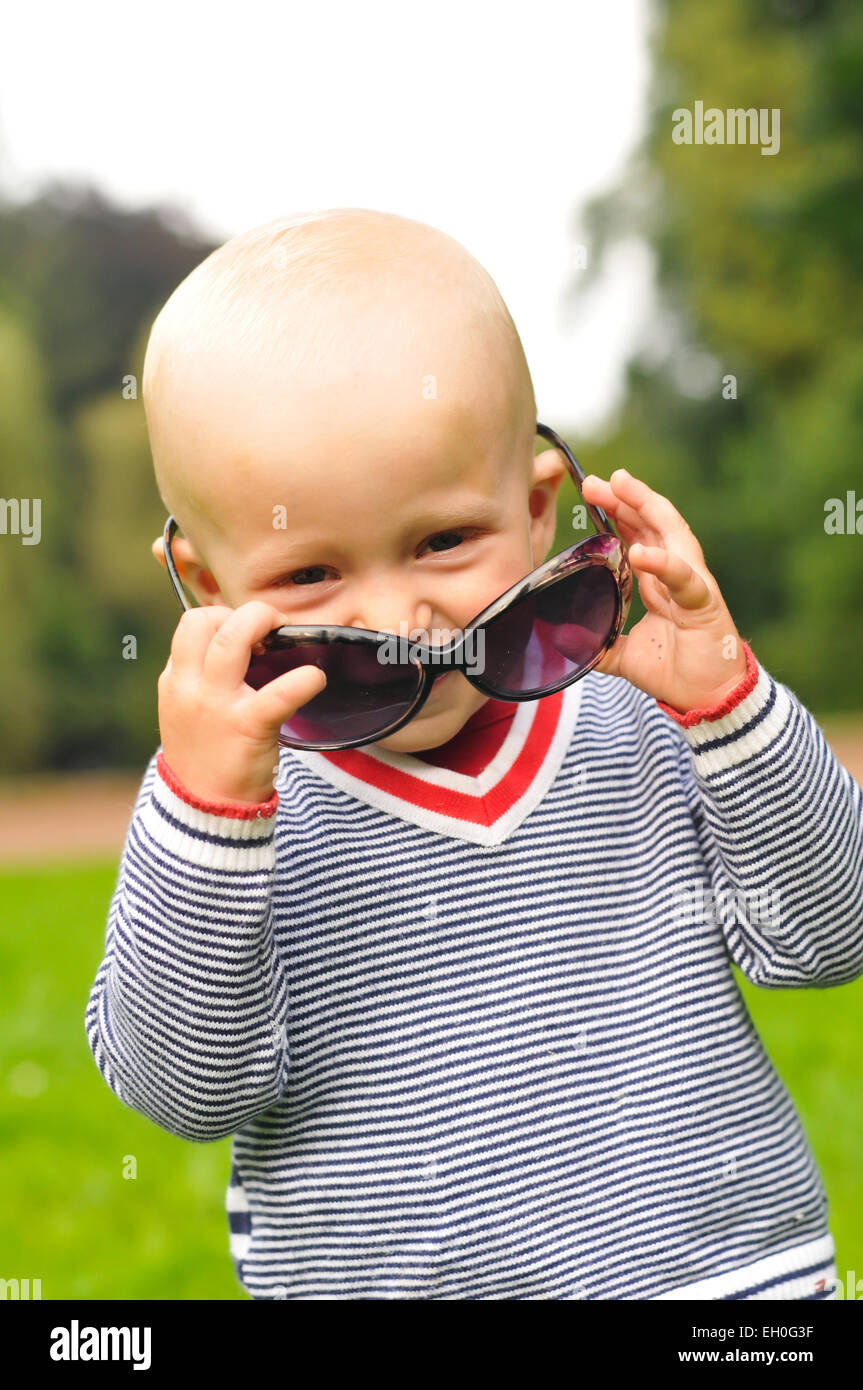 Portrait of little boy with sunglasses outdoor Stock Photo - Alamy