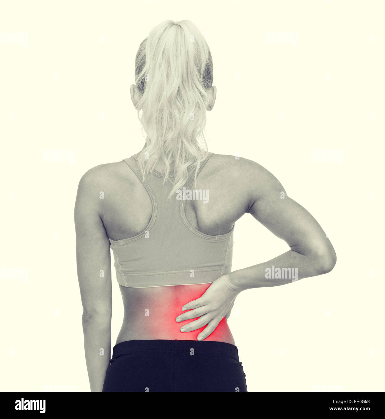 sporty woman touching her back Stock Photo - Alamy