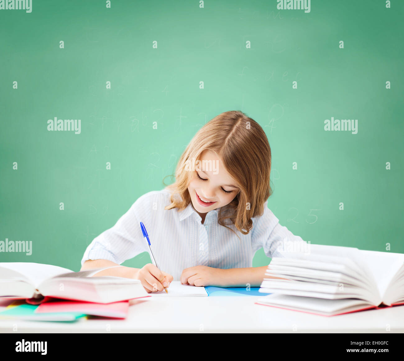 happy girl with books and notebook at school Stock Photo - Alamy