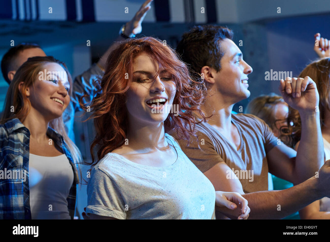 happy friends dancing at night club Stock Photo - Alamy