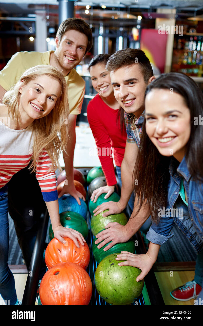 happy friends in bowling club Stock Photo - Alamy