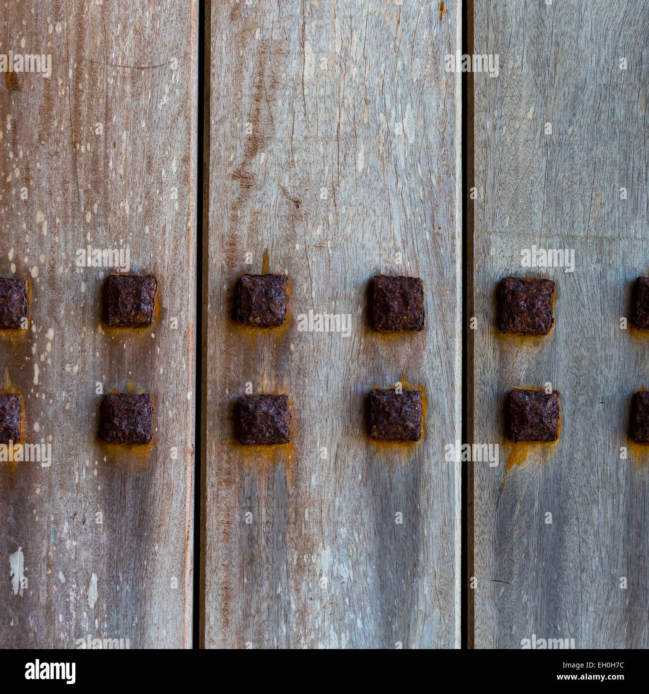 Wood and metal door with metallic spikes looking worn and grungy Stock ...