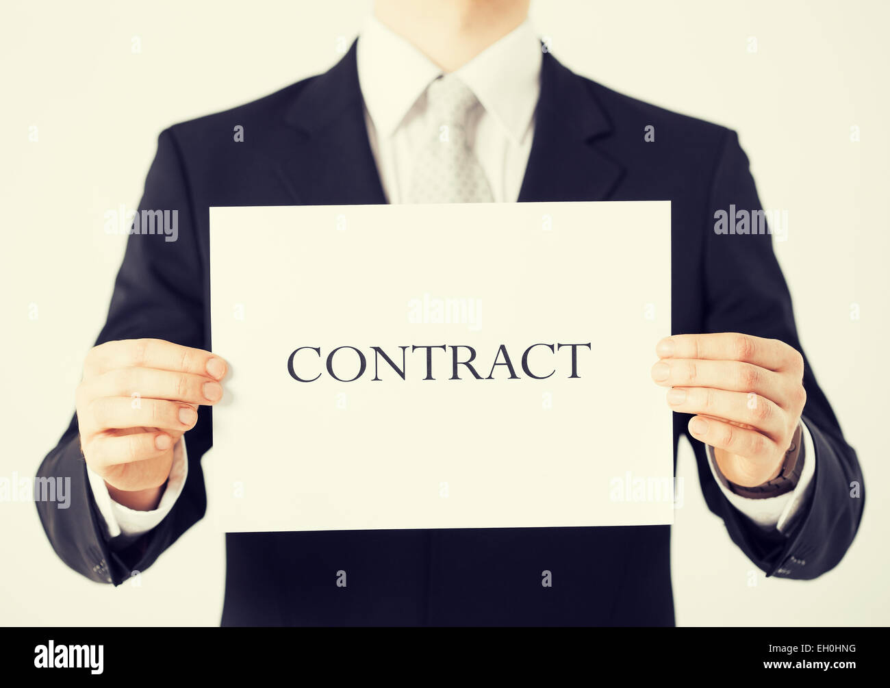 man hands holding contract paper Stock Photo - Alamy