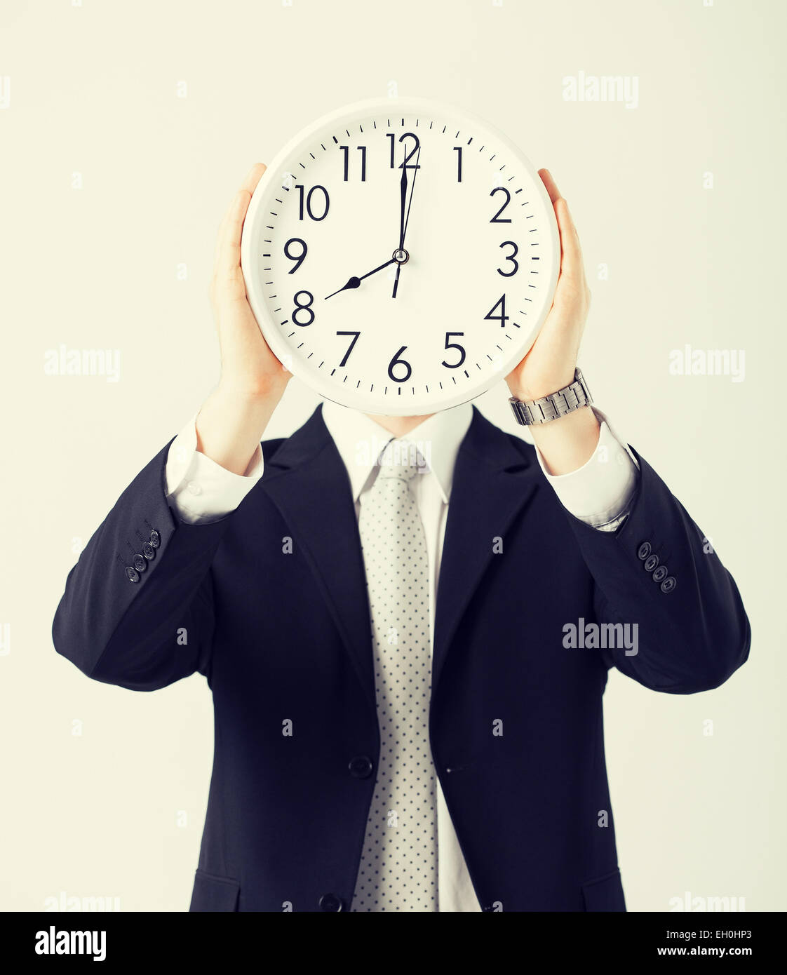 man with wall clock Stock Photo - Alamy