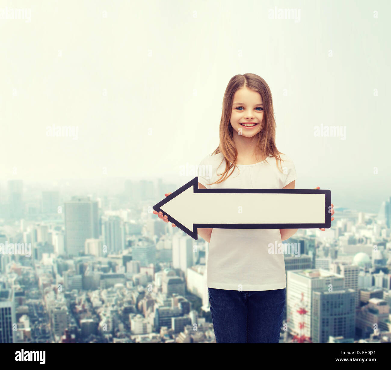 smiling girl with blank arrow pointing left Stock Photo - Alamy