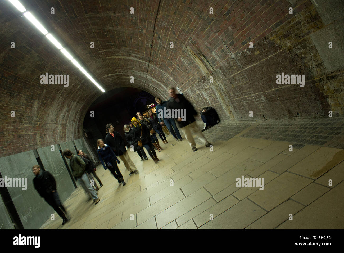 Homeless man sat inside a London underpass Stock Photo - Alamy
