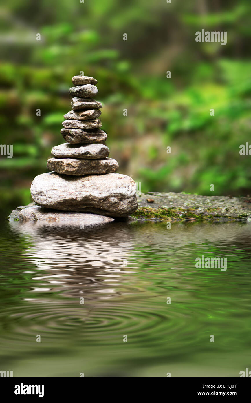 Stones with water reflection Stock Photo - Alamy