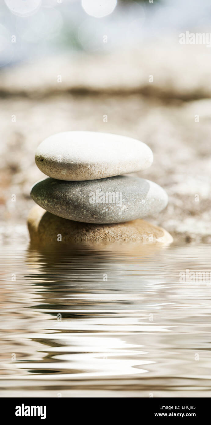 Stones with water reflection Stock Photo - Alamy