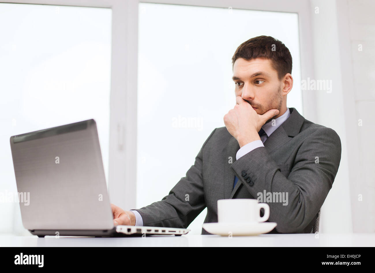 businessman with laptop typing in office Stock Photo - Alamy