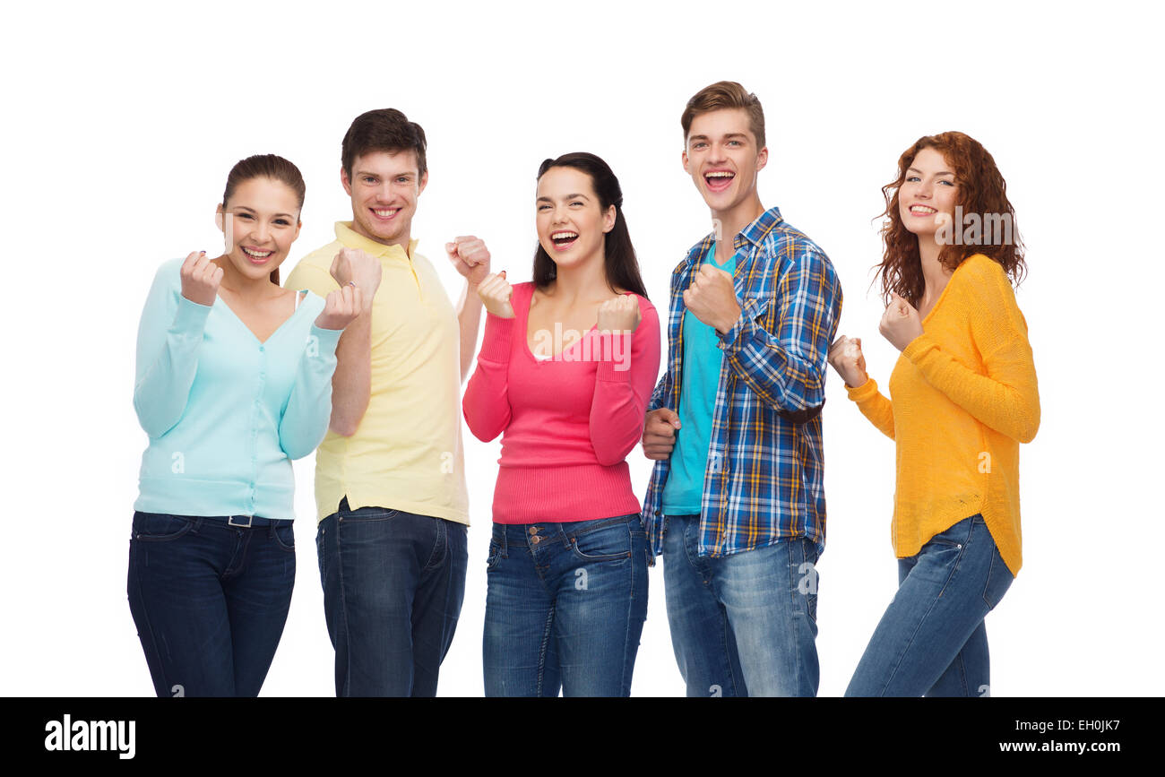 group of smiling teenagers showing triumph gesture Stock Photo - Alamy