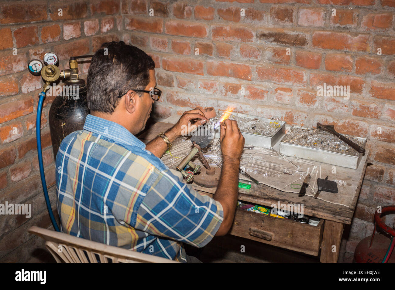 Local craftsman moulding glass figures for souvenirs at DakshinaChitra ...