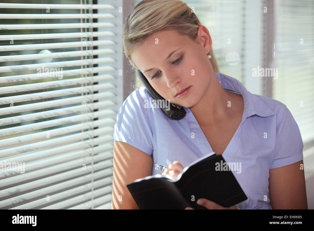 Secretary arranging an appointment Stock Photo - Alamy