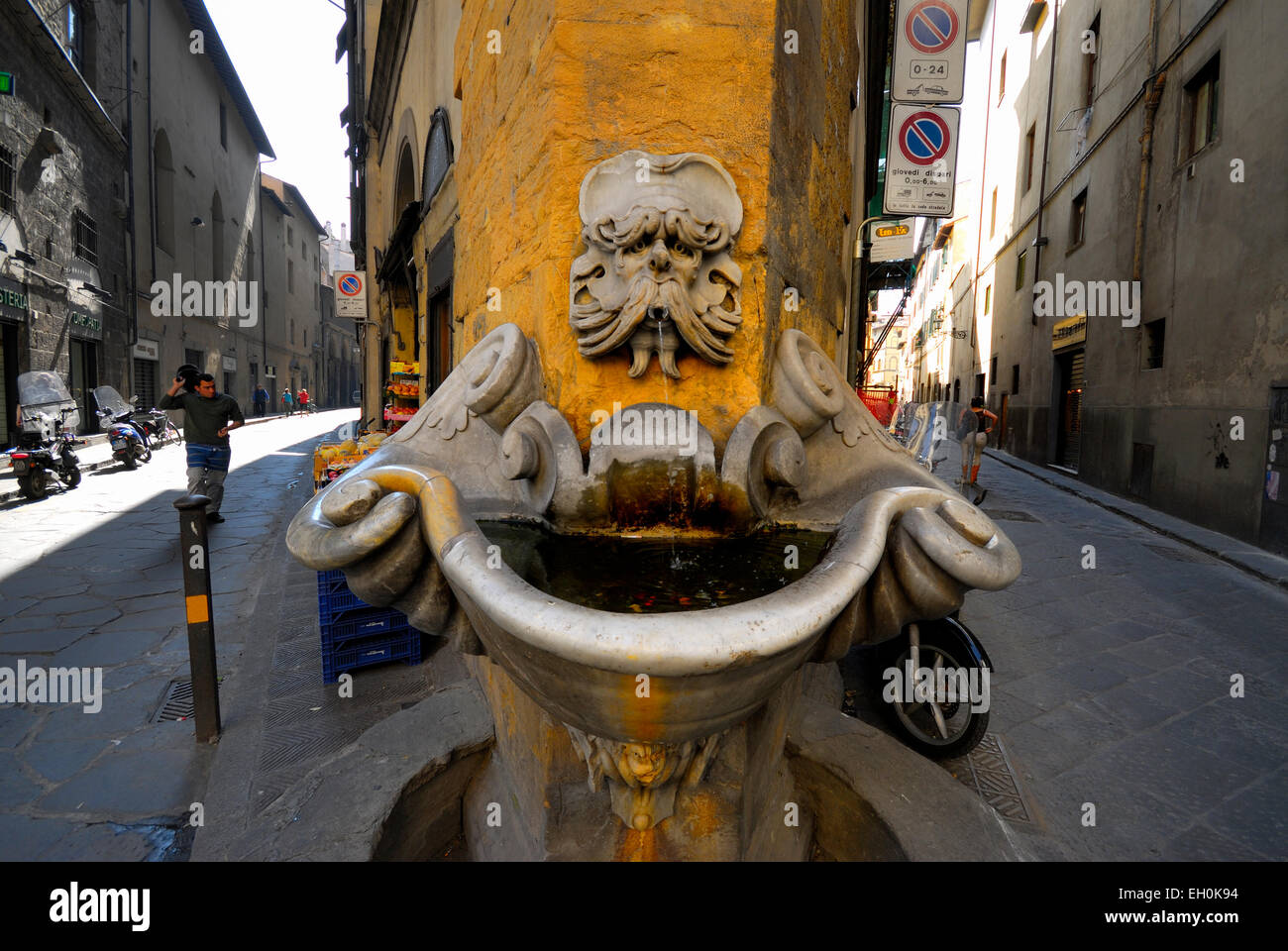 Water arching out of an outdoor public drinking fountain, Florence ...