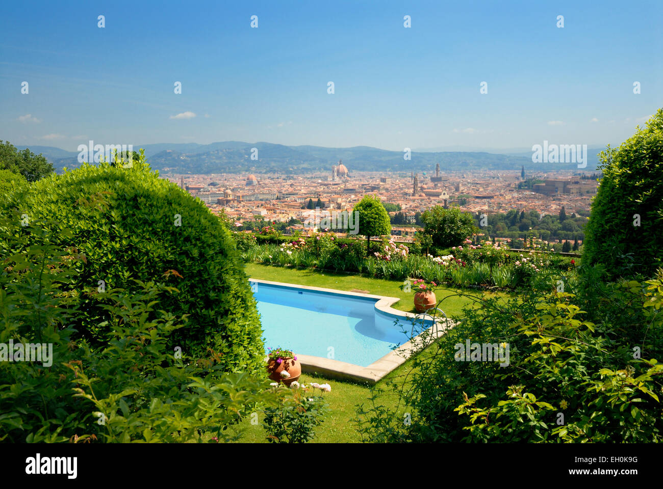 Swimmingpool in a garden with magnificent view over city of Florence ...