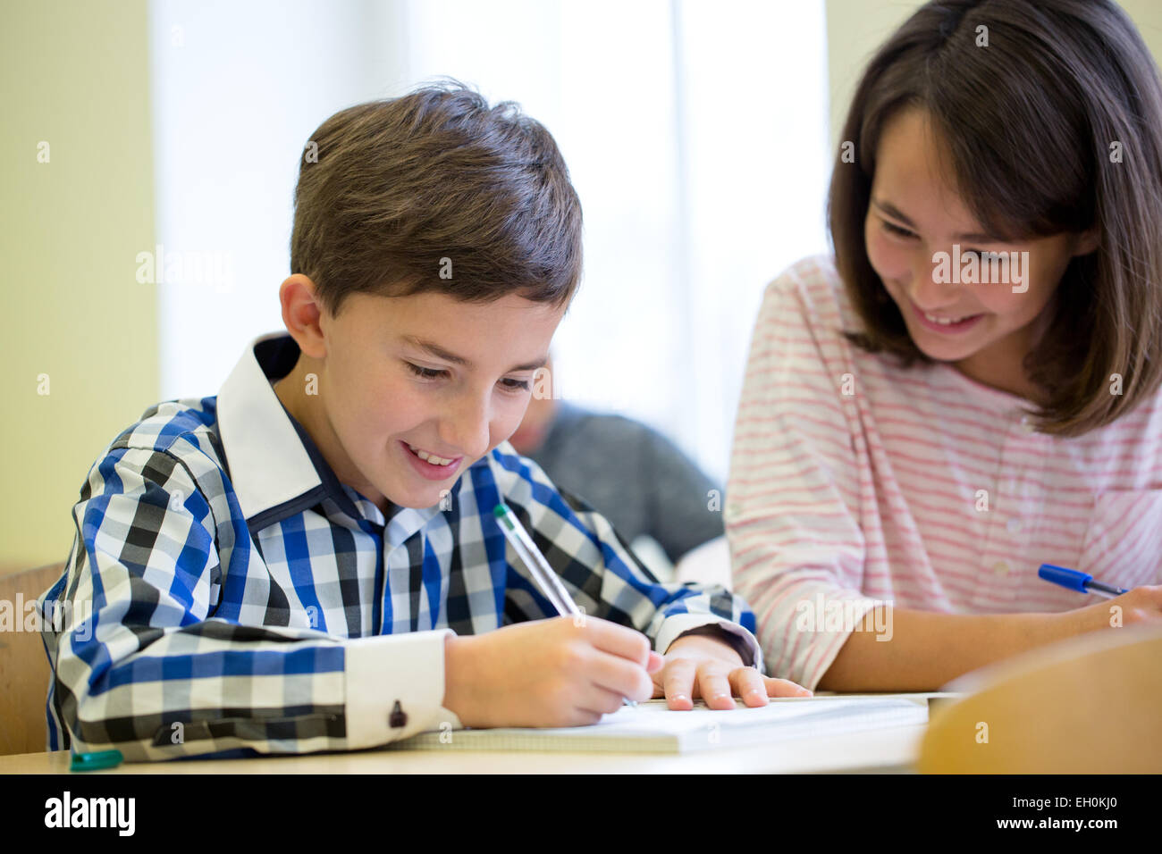 group of school kids writing test in classroom Stock Photo - Alamy