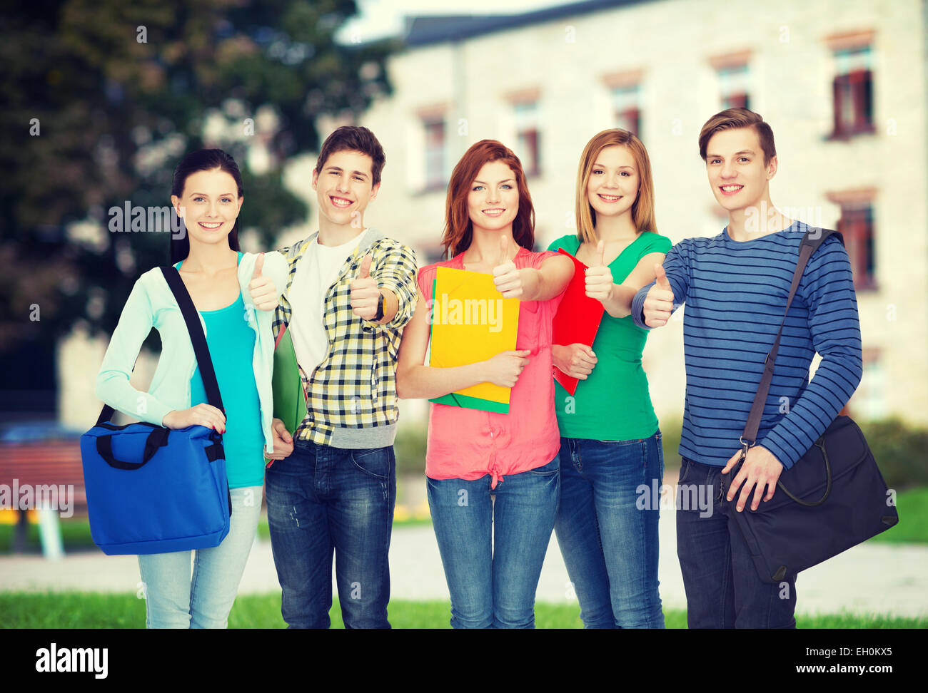 group of smiling students standing Stock Photo - Alamy