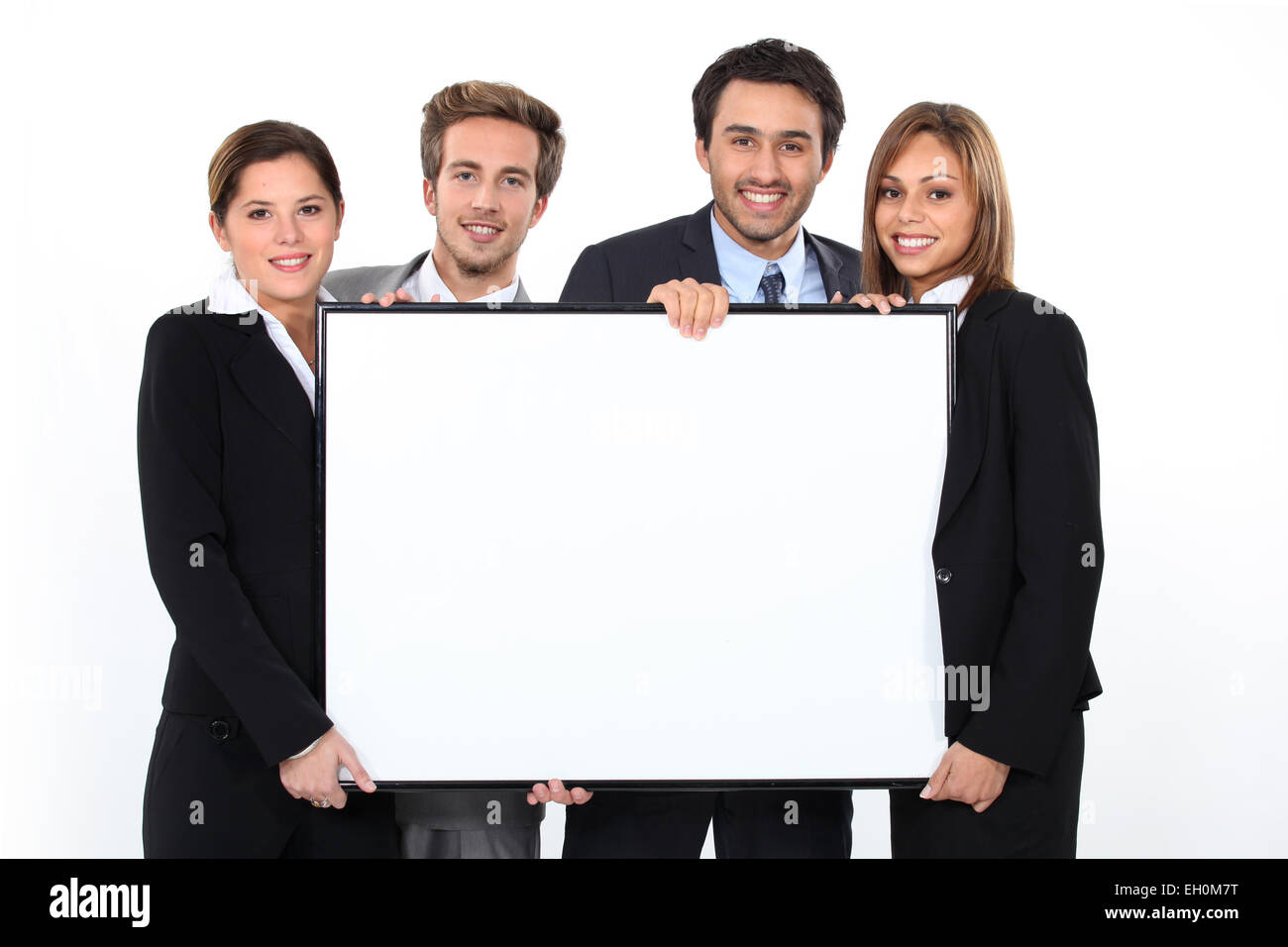Business team holding blank poster Stock Photo - Alamy