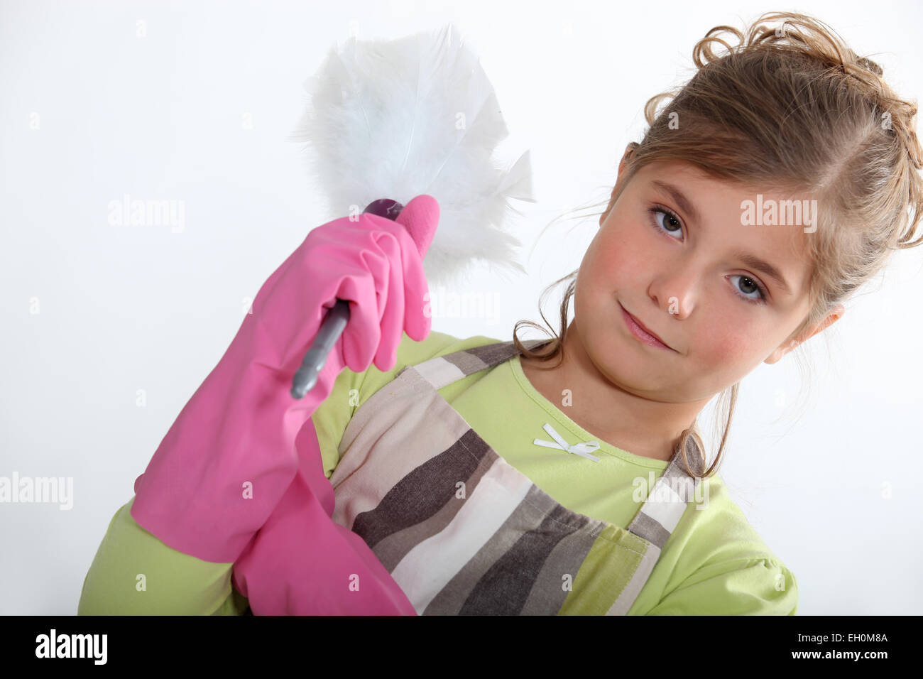 Little girl with duster Stock Photo - Alamy