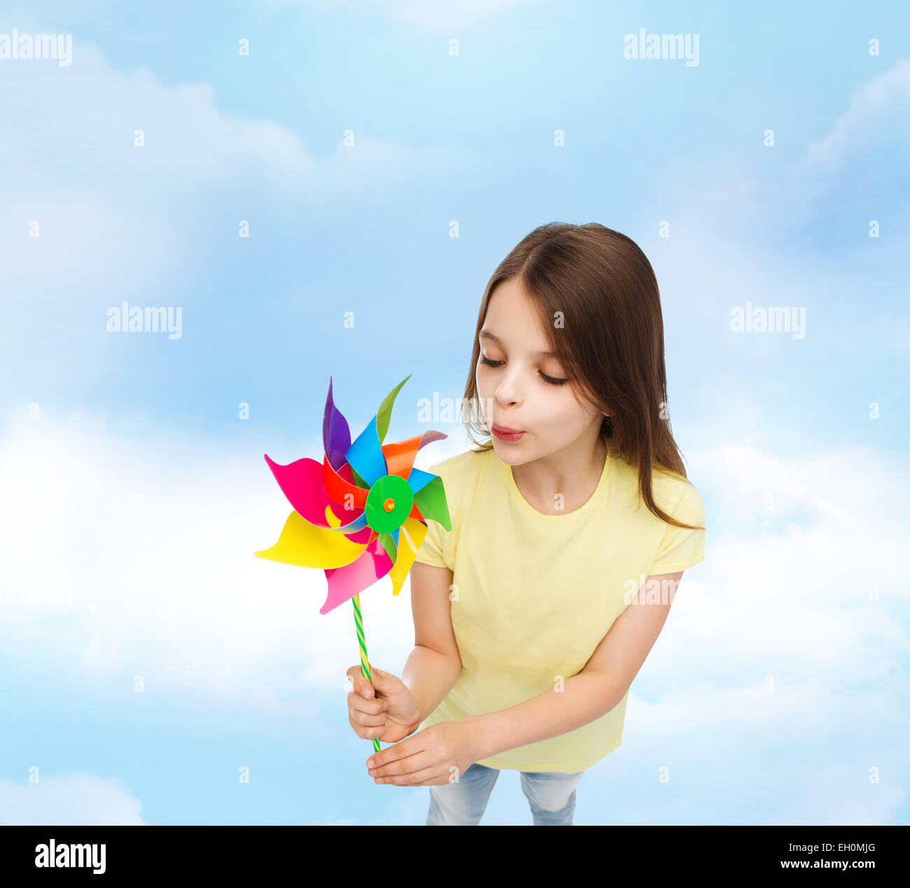 smiling child with colorful windmill toy Stock Photo - Alamy