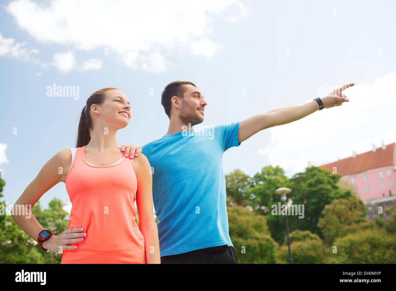 two smiling people outdoors Stock Photo - Alamy