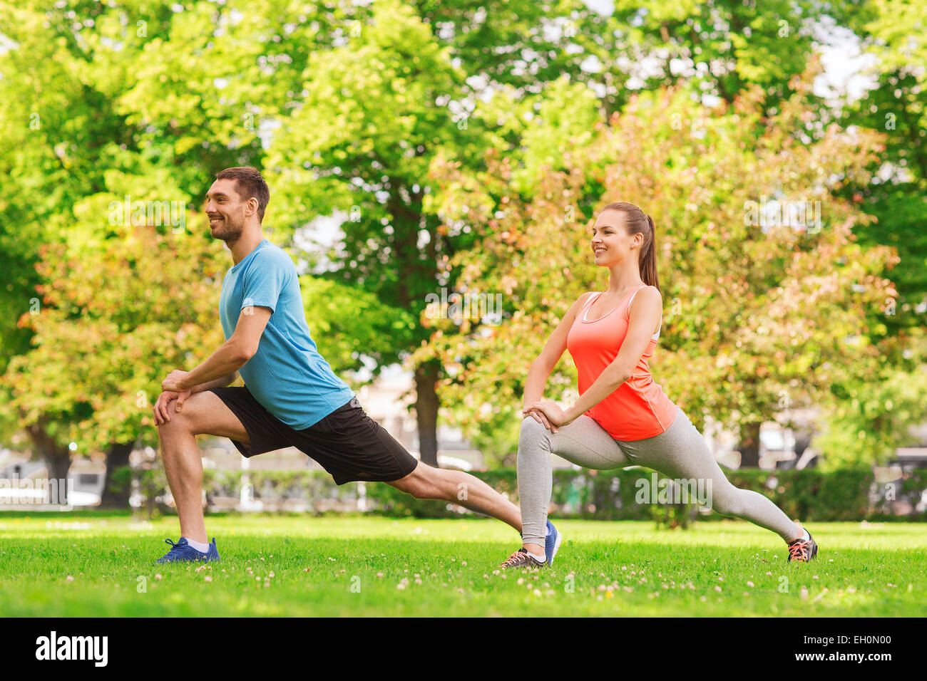 Man woman stretching legs together hi-res stock photography and images ...