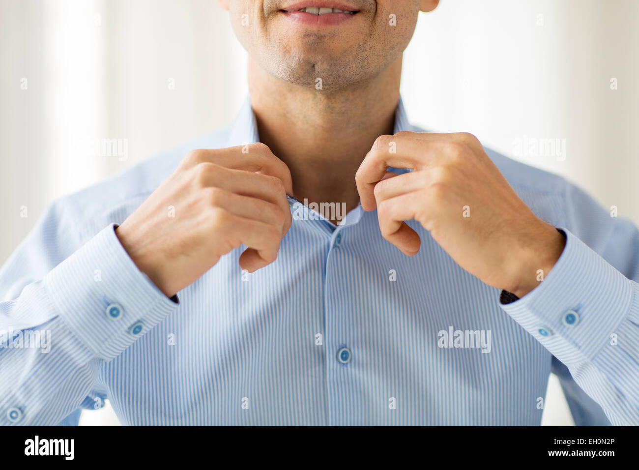 close up of smiling man in shirt dressing Stock Photo - Alamy