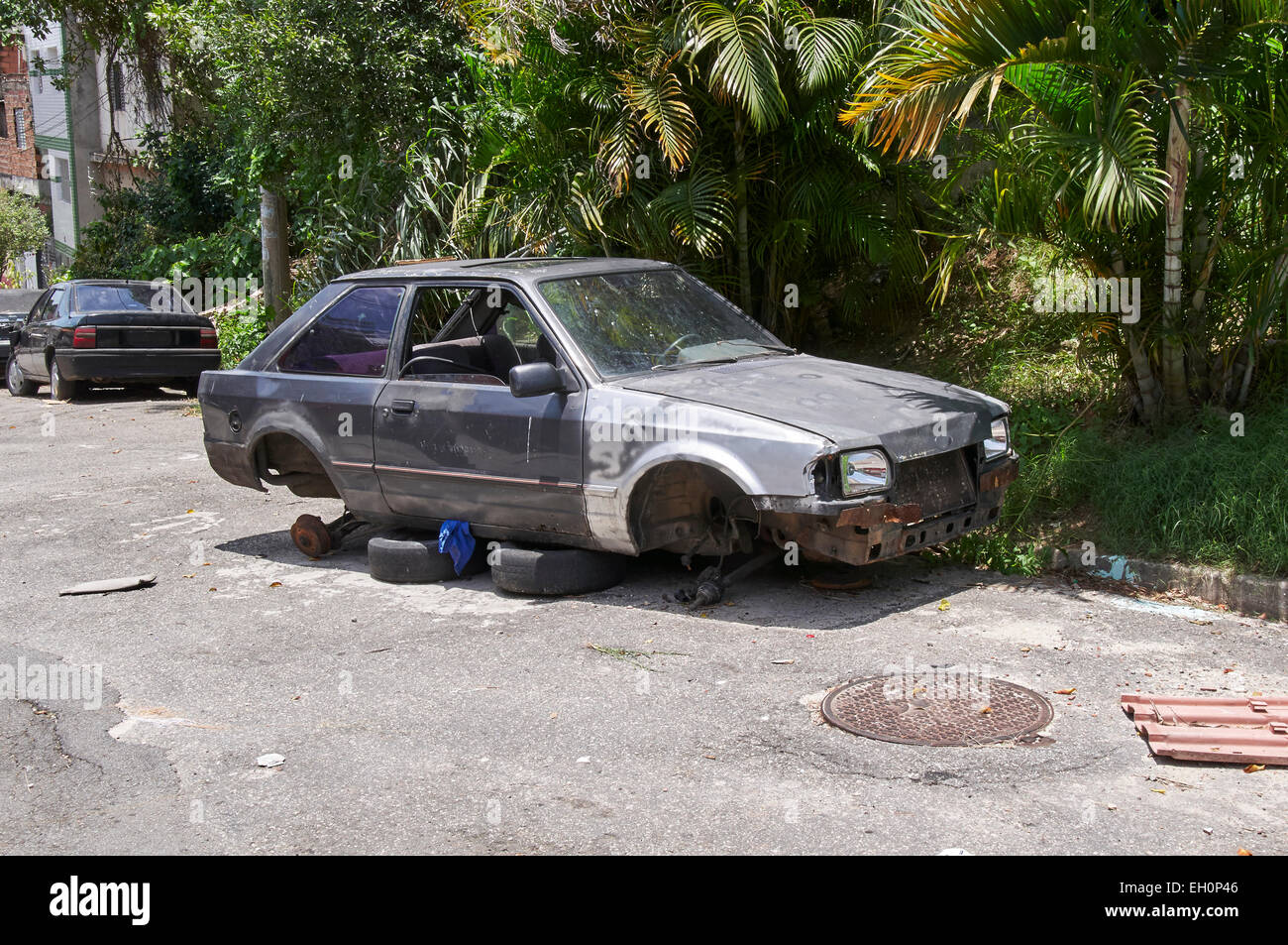 Car broken, crumpled and abandoned in Sao Paulo city Stock Photo - Alamy