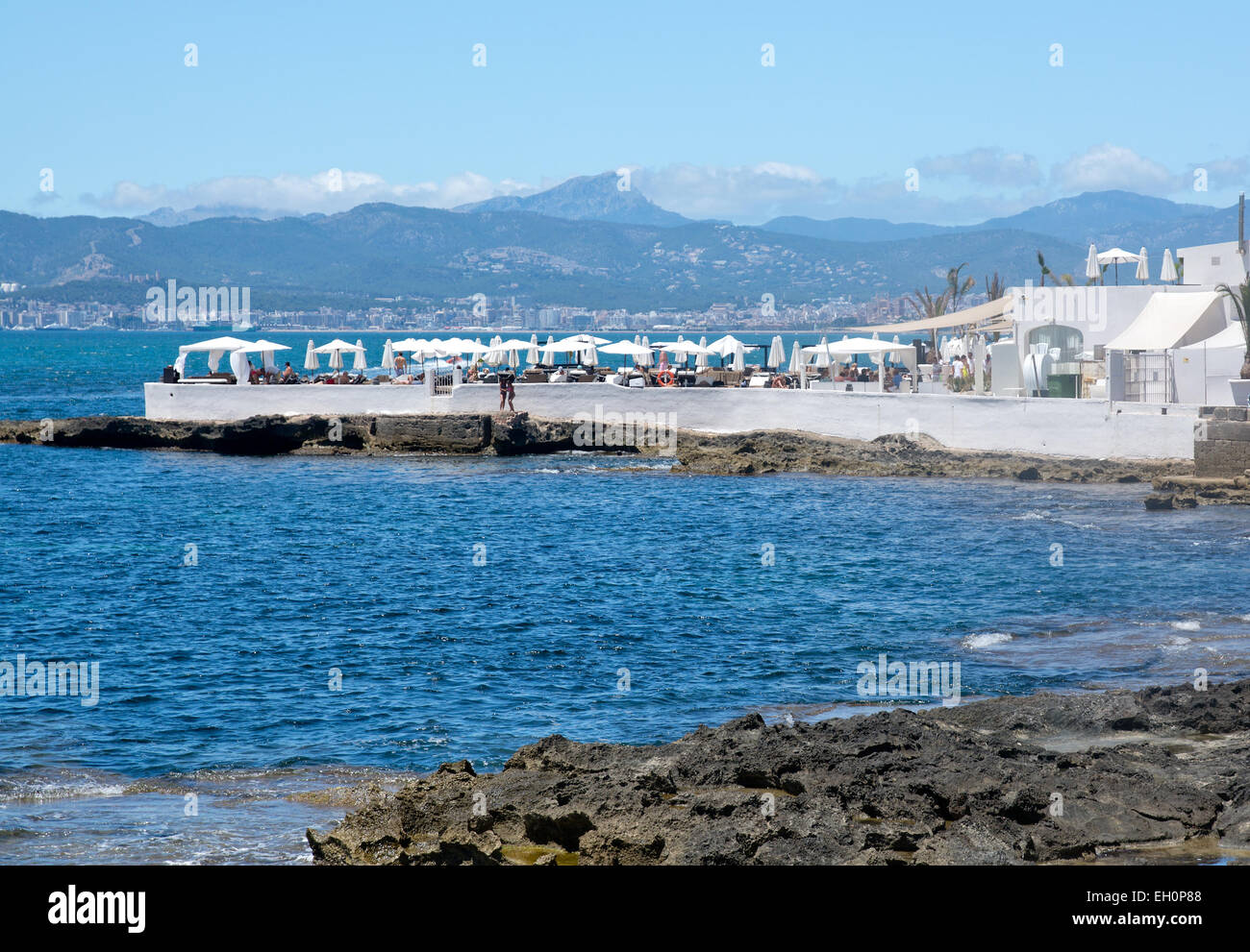 Puro Beach club with people and bay scene Stock Photo - Alamy