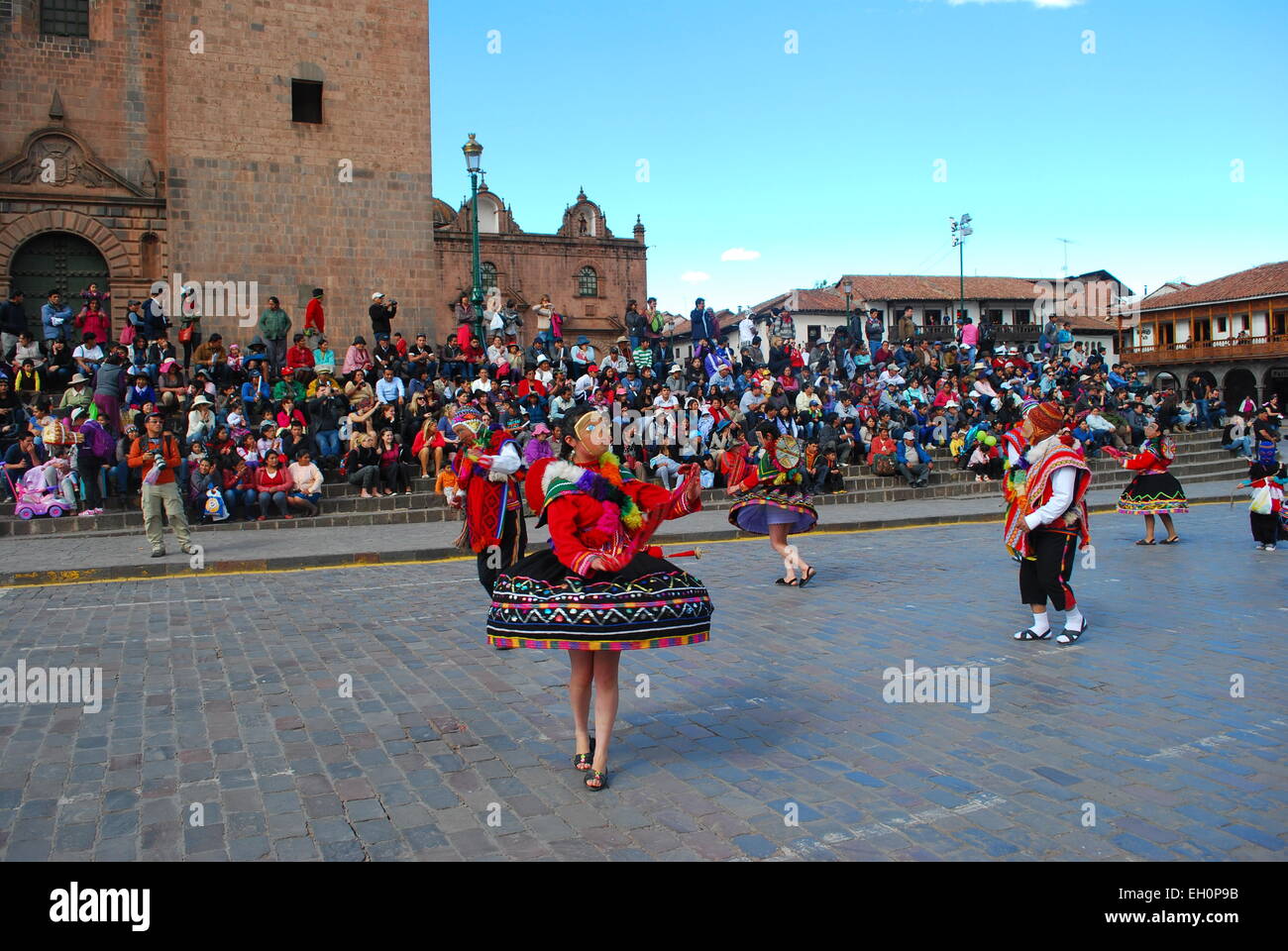 Locals performing in traditional dress at a religious festival in the ...