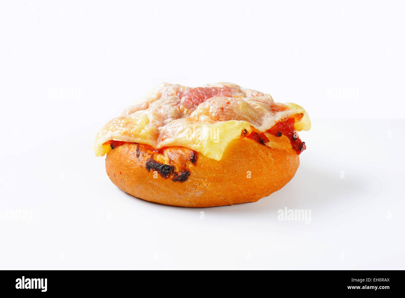 Bread bun with slices of cheese and ham on top Stock Photo - Alamy