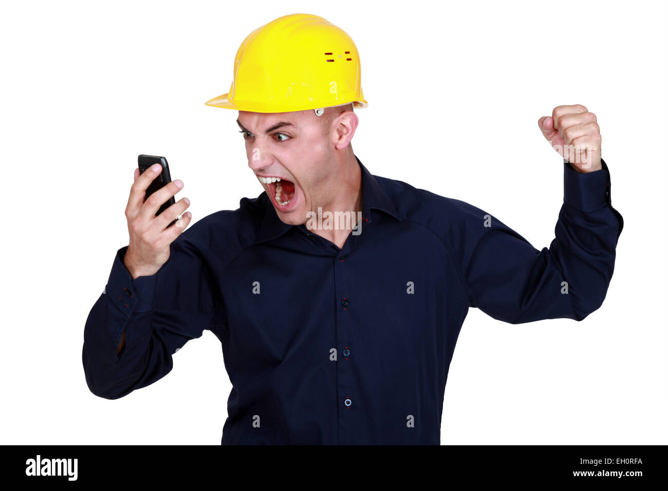 Worker angry with mobile Stock Photo - Alamy