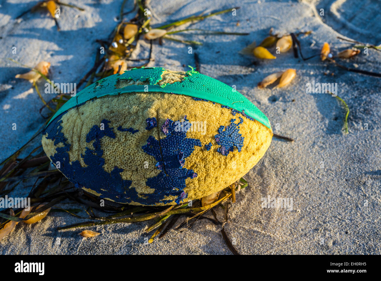 Styrofoam football lying on a beach Stock Photo - Alamy