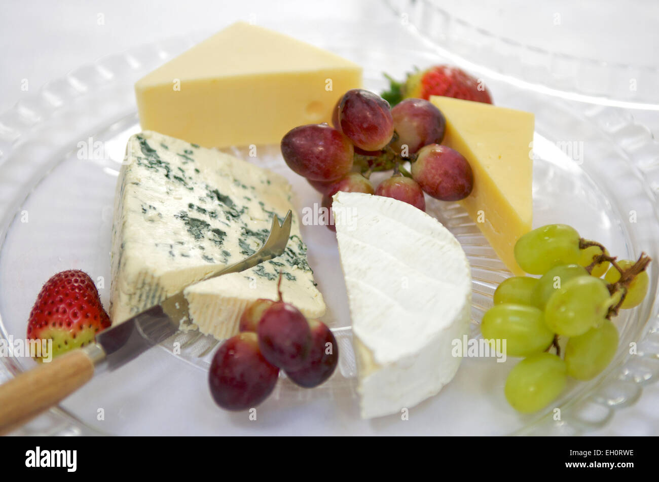 Selection of cheeses with grapes Stock Photo - Alamy