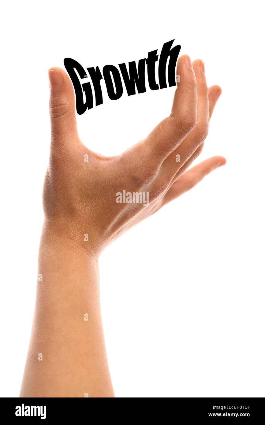 Vertical shot of a hand squeezing the word "Growth" between two fingers ...