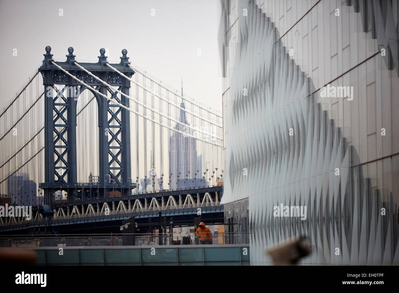 Manhattan Bridge and the Empire State Building in Manhattan in New York ...