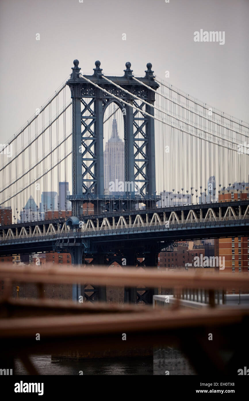 Manhattan Bridge and the Empire State Building in Manhattan in New York ...