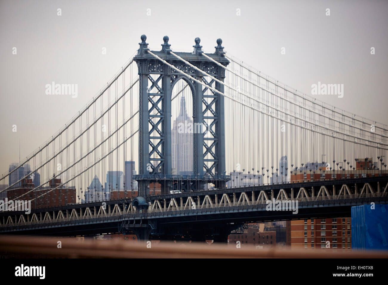 Manhattan Bridge and the Empire State Building in Manhattan in New York ...