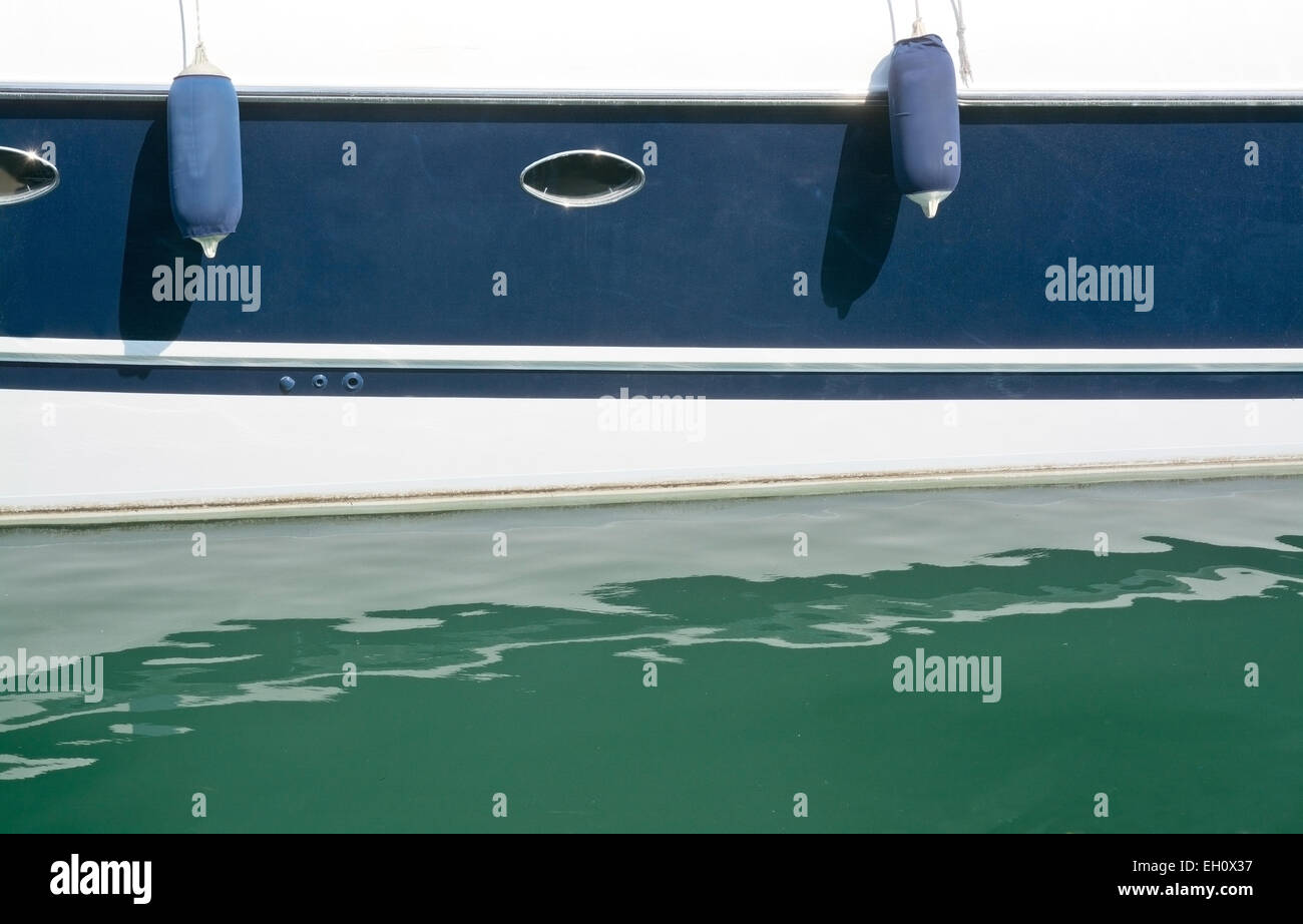 Marine details and colors closeup of beautiful marine blue sailboat or ...