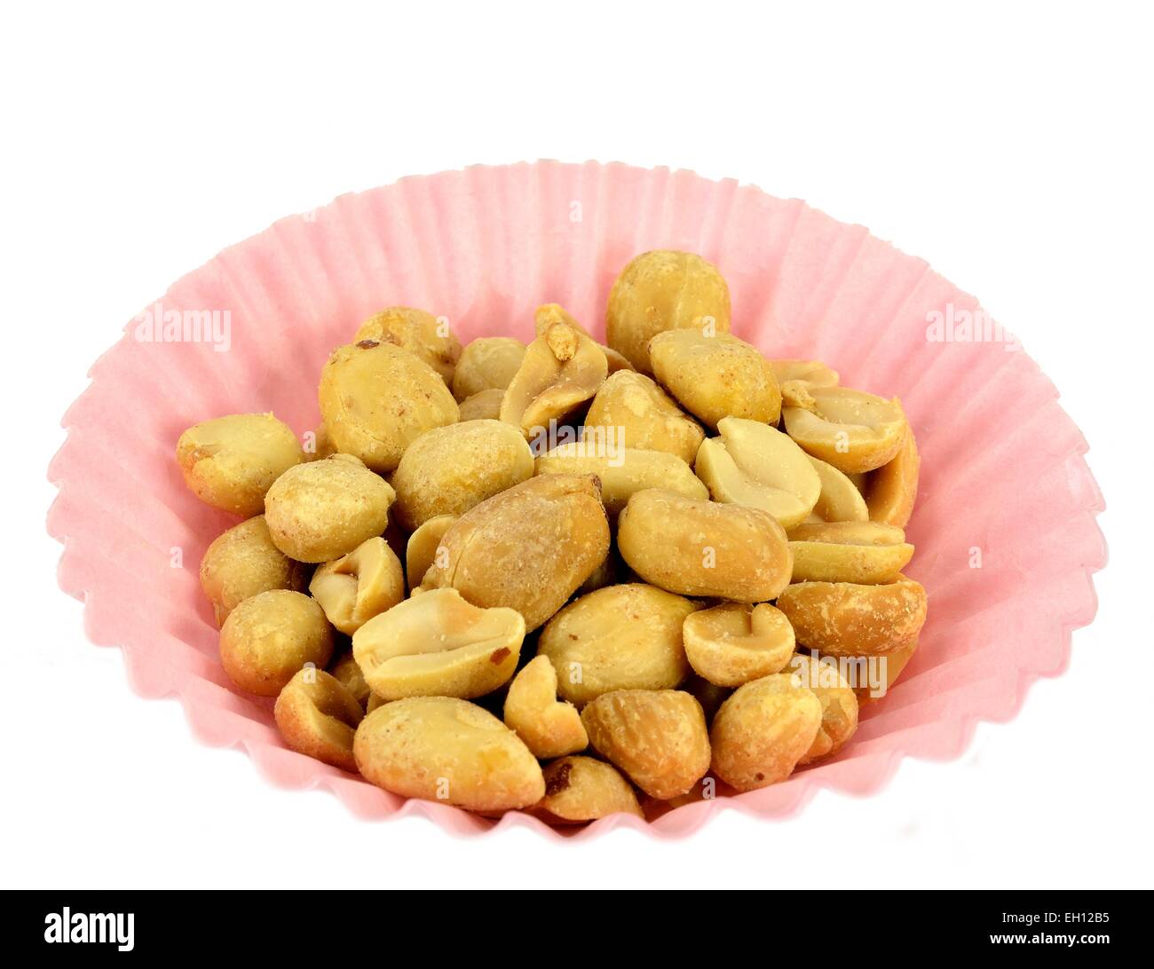 Peanuts in a pink paper dish on a white background Stock Photo - Alamy