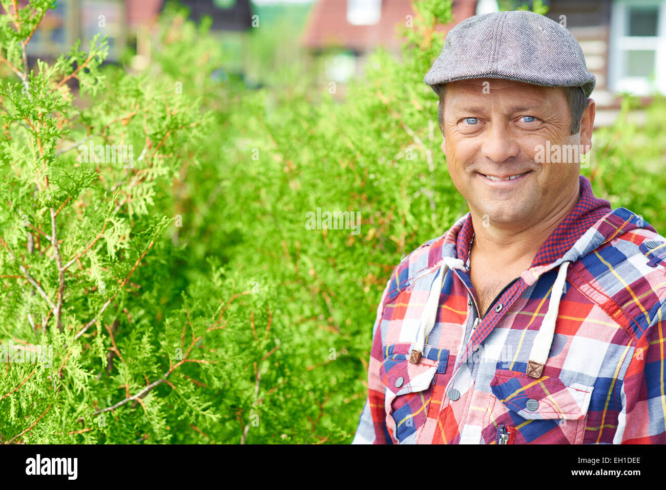 Portrait of a smiling professional farmer Stock Photo - Alamy