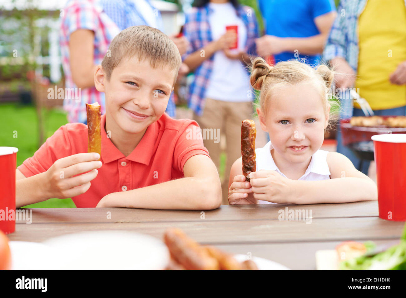 Little children at barbecue with family Stock Photo - Alamy