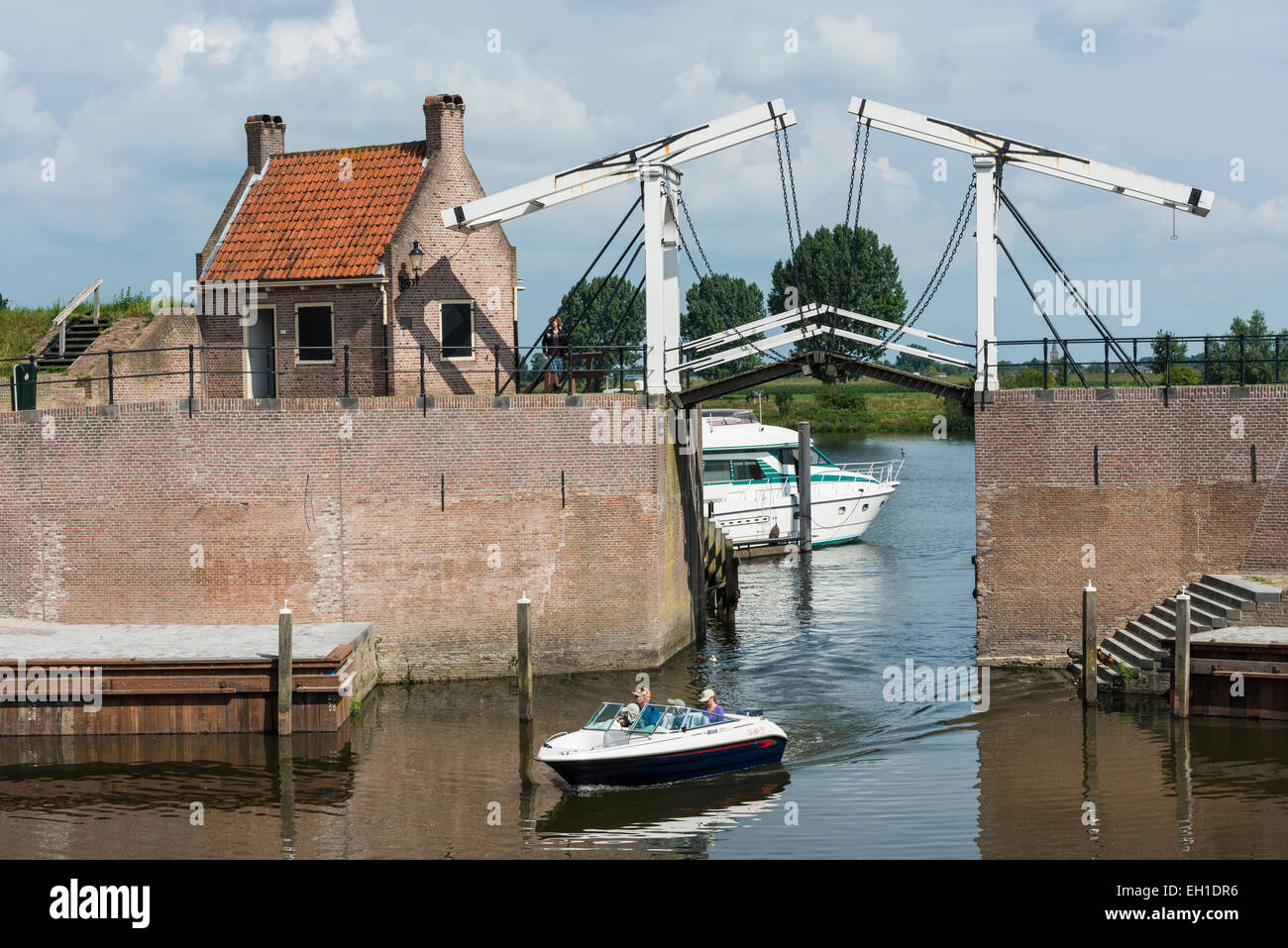 The little harbor of Heusden with two ships and a lifting bridge Stock ...