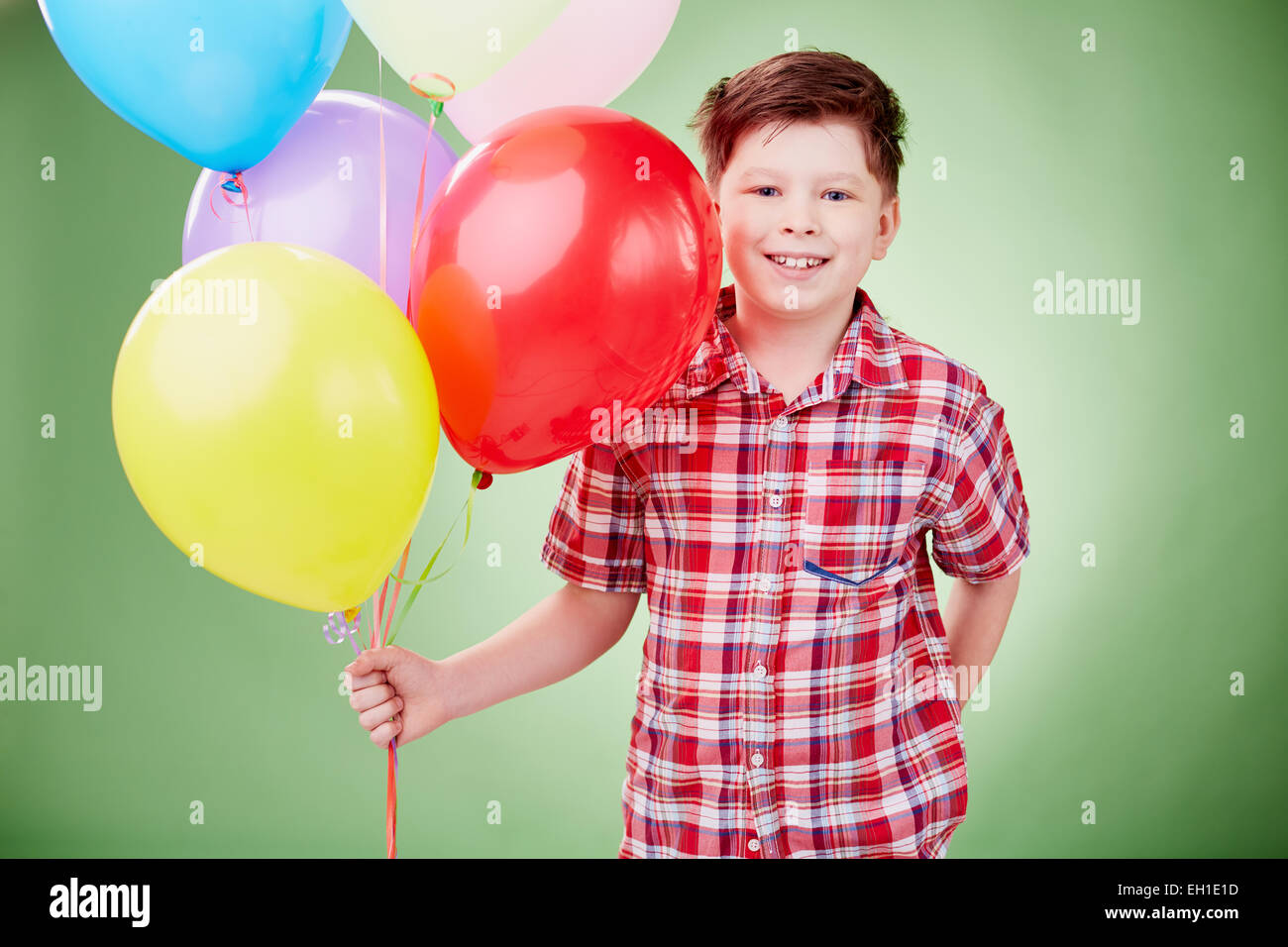 Portrait of little boy with balloons Stock Photo - Alamy